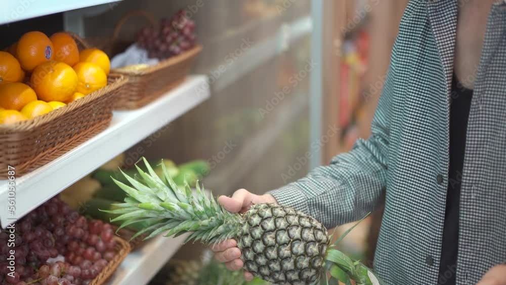 Happy handsome caucasian white man walking and picking up some fruits ...