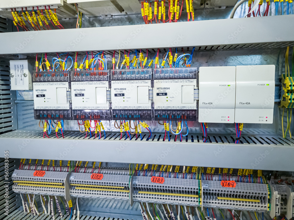Mitsubishi PLC modules in a row in electrical cabinet of automation ...