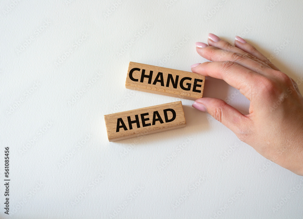 Change ahead symbol. Wooden blocks with words Change ahead. Businessman ...