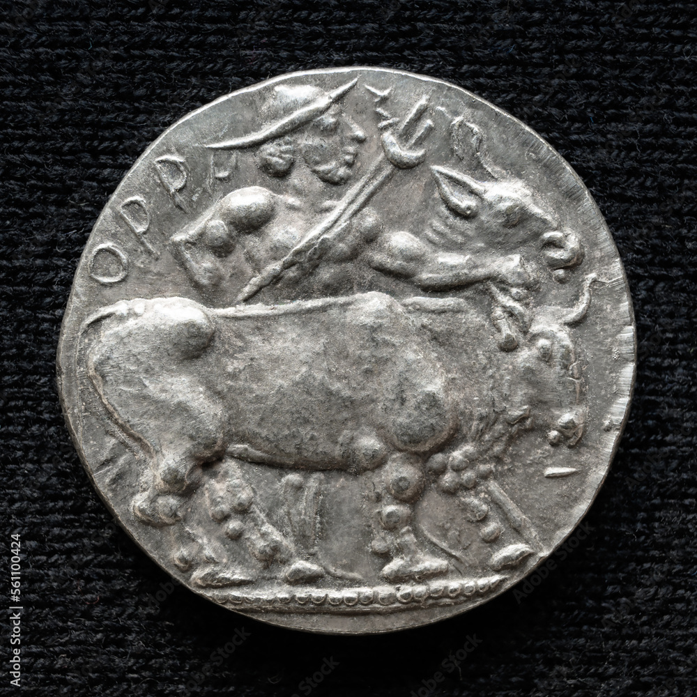 Ancient silver coin with image of bull, old vintage money isolated on ...