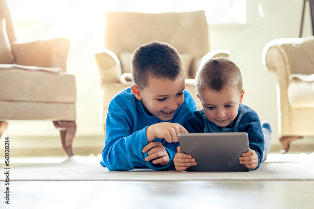 Happy children playing video games Stock Photo | Adobe Stock