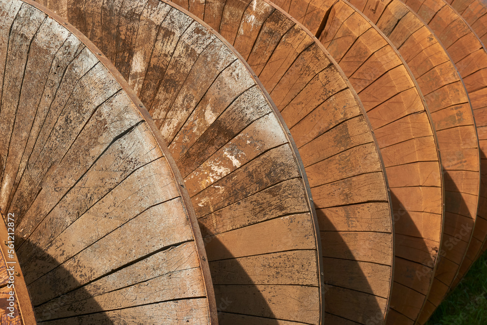 Closeup of old wooden screw pump to pump water from low to high. Also ...
