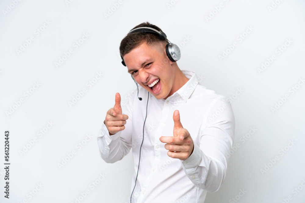Telemarketer Brazilian man working with a headset isolated on white ...
