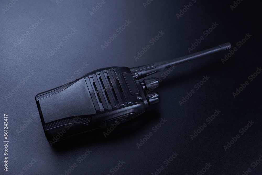 Black rectangle portable device with antenna isolated on black ...