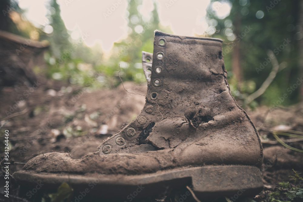 Old weathered leather work boot that was uncovered during a recent ...