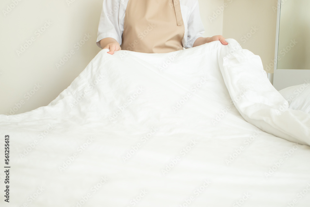 making bed, hotel room service, housekeeping, cleanliness in the ...