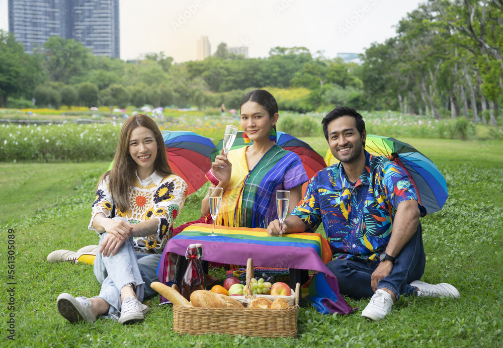 group of friends in colorful rainbow lgbt dresses having a picnic in ...