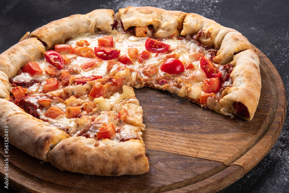 Pizza Margherita on black stone background. Pizza for company. One ...