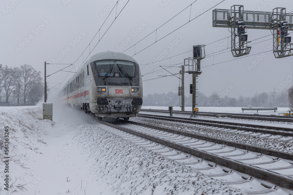Bavaria, Germany, December 2022, IC, german train drives through a ...
