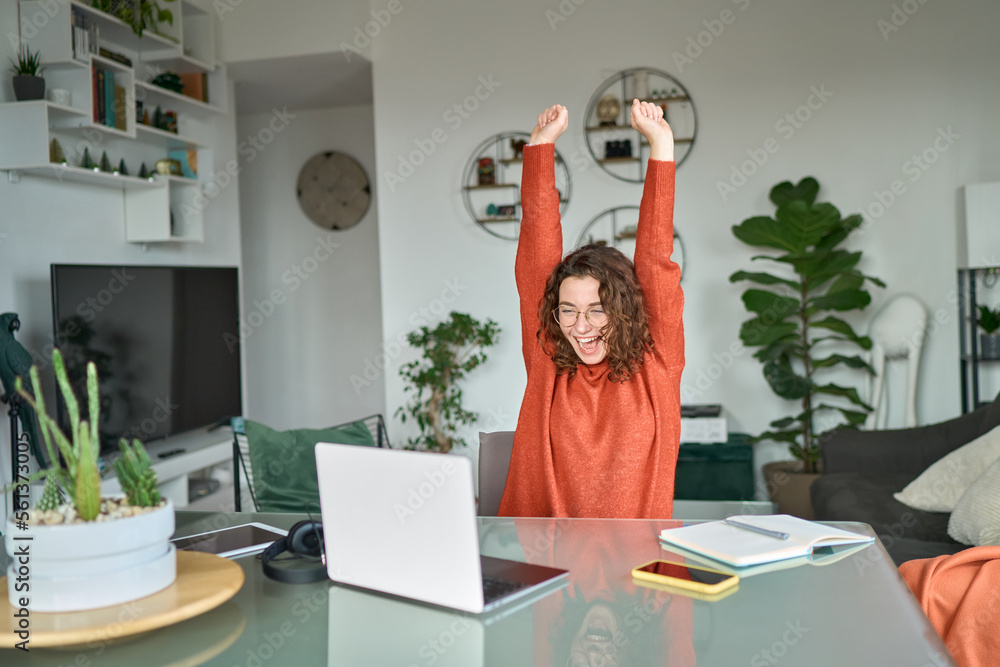 Young excited happy woman student winner success using computer laptop ...