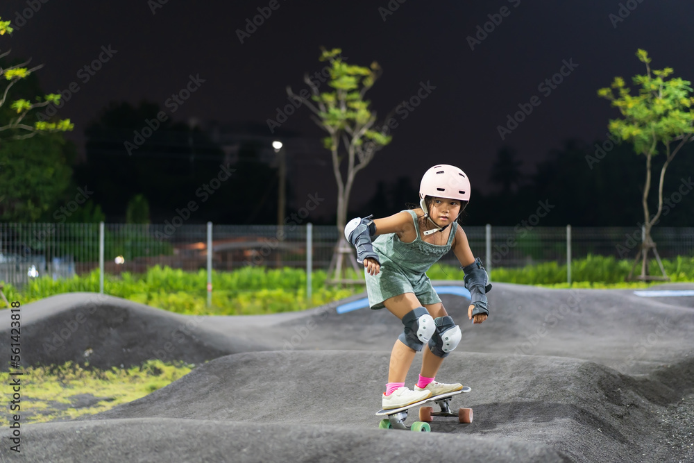 asian child skater or kid girl fun playing skateboard or ride surf ...