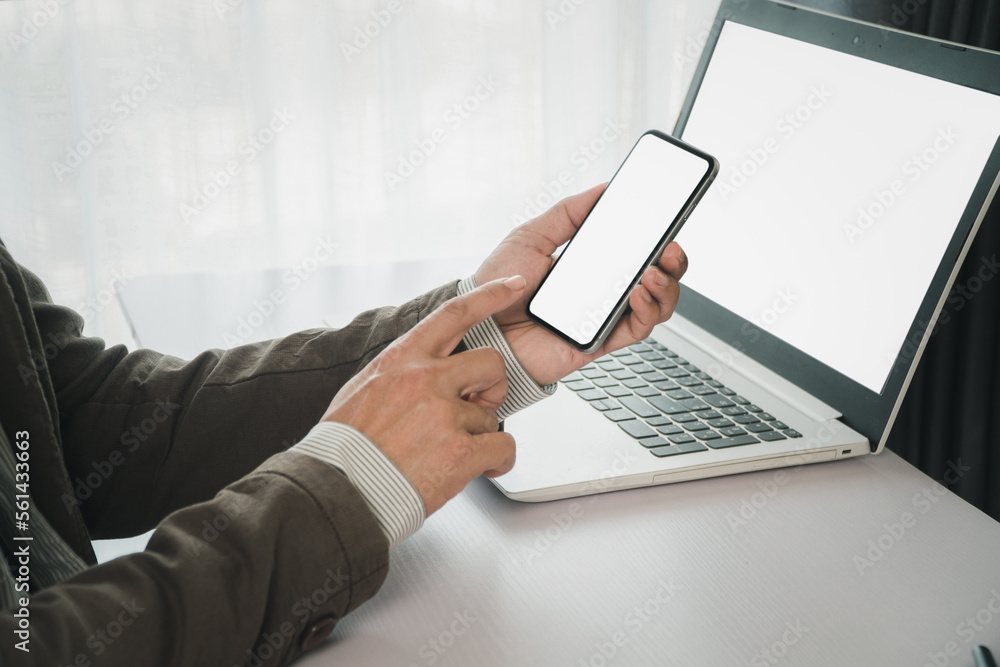 Bussinessman hand holding smartphone and finger point to smartphone or ...