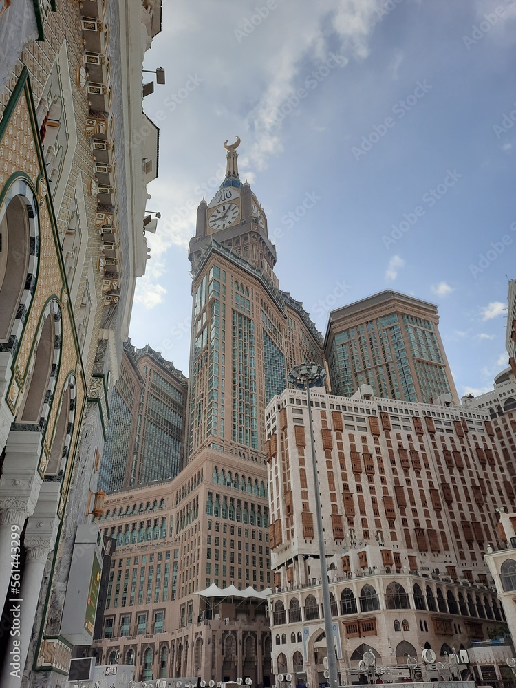 A beautiful daytime view of the Mecca Clock Tower in front of the Grand ...