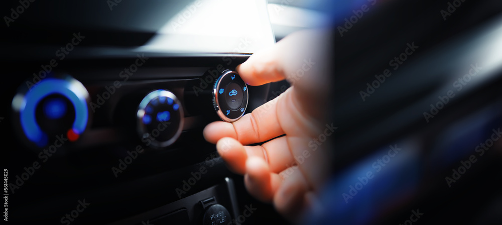The process of choosing climate control in the car. Various controls in ...