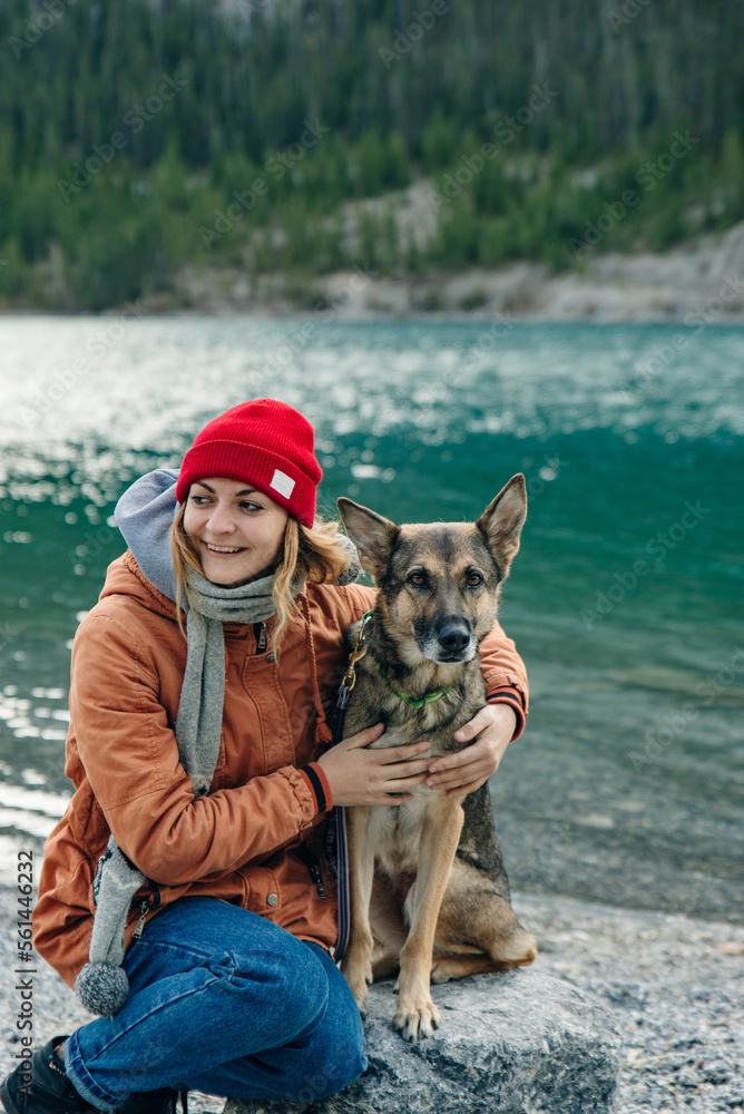 Human and a dog. female and her friend dog husky on the nature forests ...
