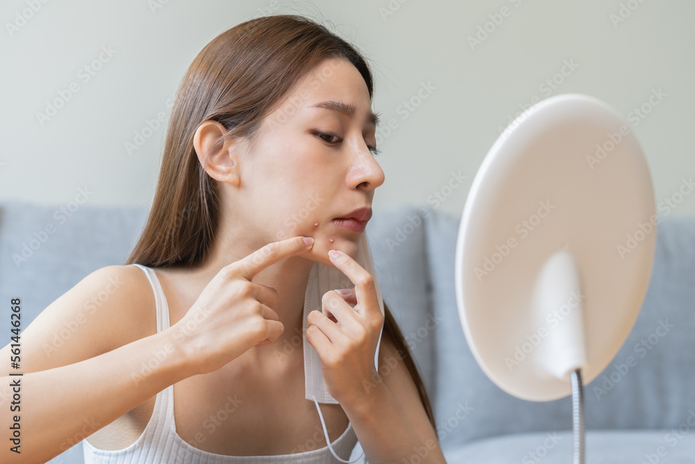Expression worry asian young woman hand touching pustule around the ...