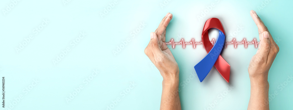 hand hold 3d red blue awareness ribbon with line of heart cardiogram ...