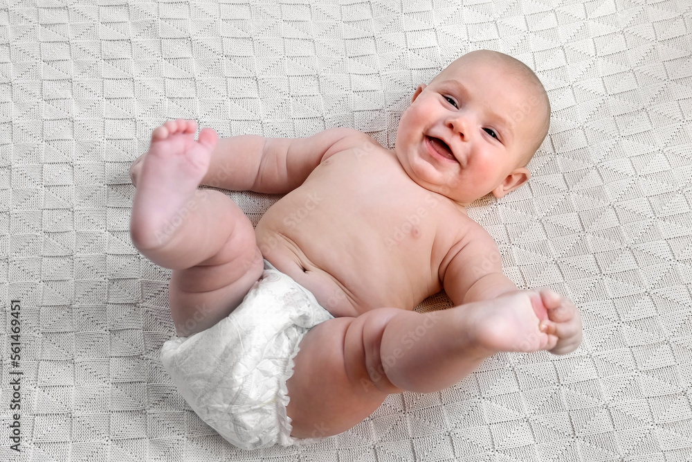 Cute Newborn Baby Lying on the Back in a Child Crib on White. Top View ...