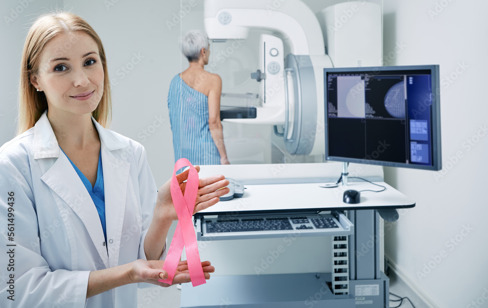 Breast cancer awareness ribbon in radiologist mammologist hands while ...