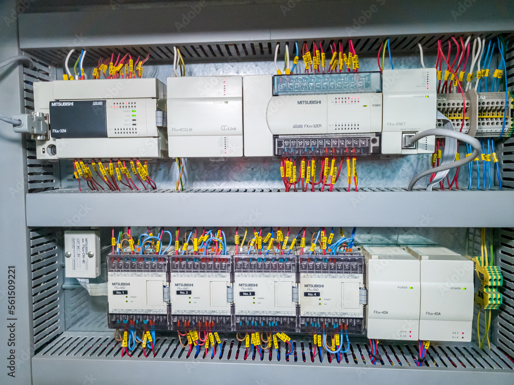 Mitsubishi PLC modules in a row in electrical cabinet of automation ...