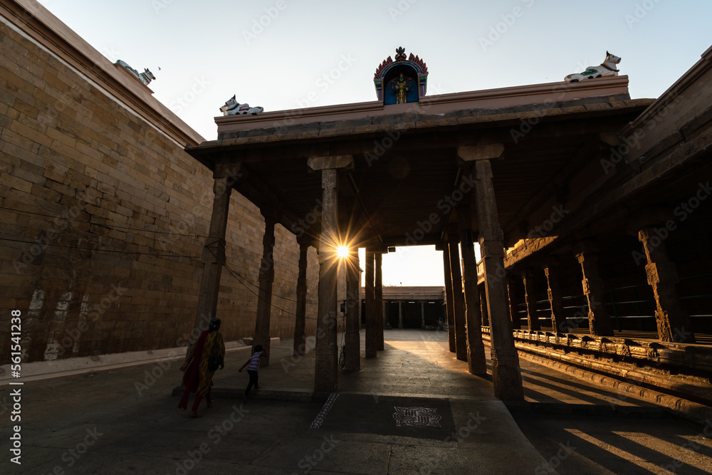 Sunset behind the columns of a pavilion in the ancient Hindu temple of ...