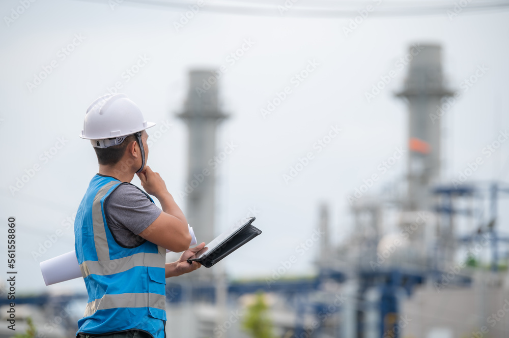 Two engineer working at power plant,Work together happily,Help each ...