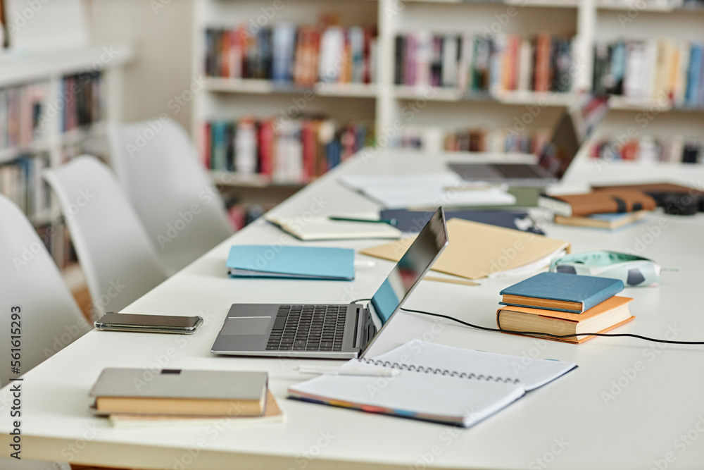 Side view background image of work table in college library with ...