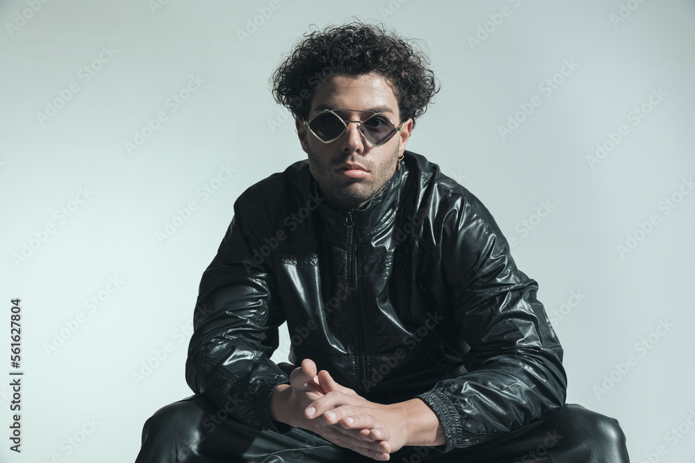 handsome turkish man with curly hair in leather jacket posing Stock ...