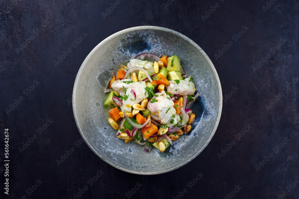 Traditional Peruvian gourmet ceviche sea bass filet piece with sweet ...