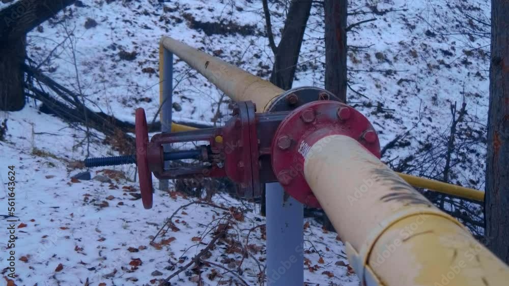 Natural gas main pipes of yellow color and a large red fuel regulating ...