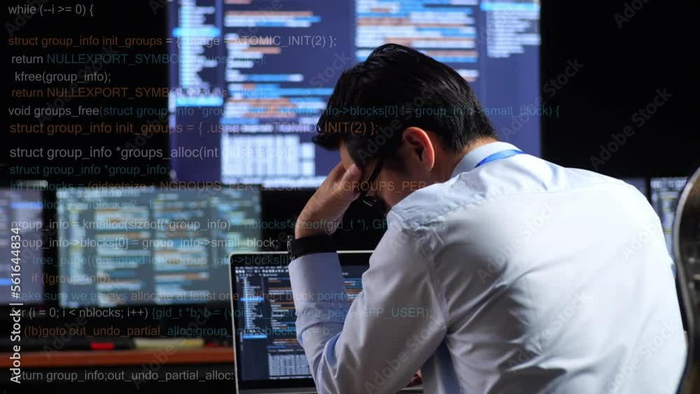 Back View Of Asian Male Programmer Having A Headache While Writing Code By A Laptop Using ...
