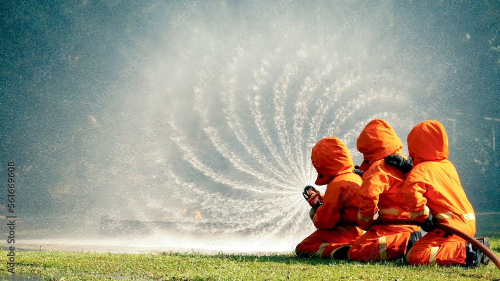 Firefighter Rescue team training in fire fighting extinguisher ...