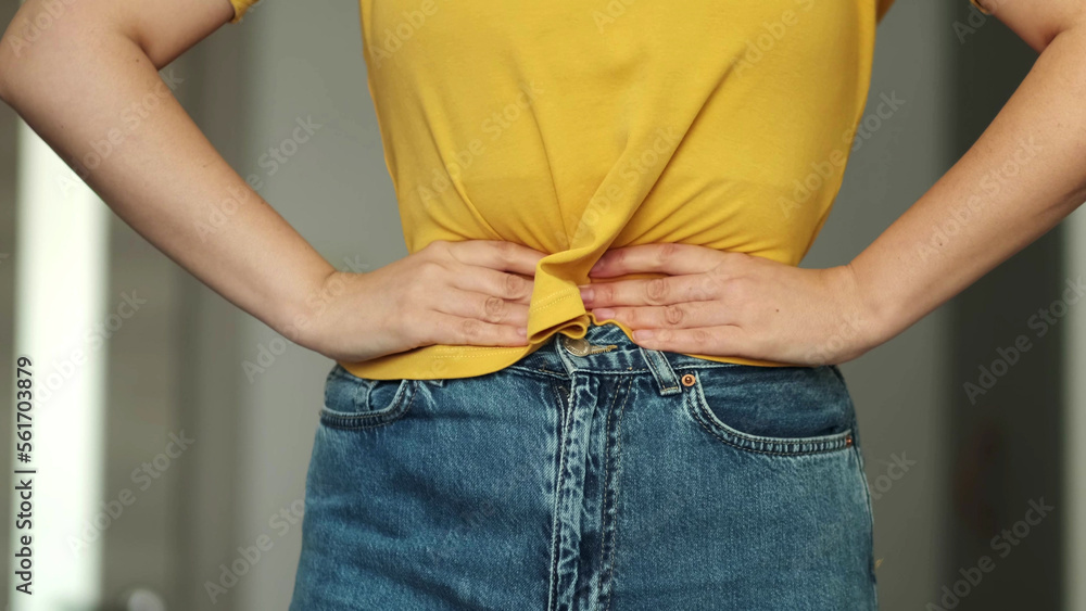 Cropped shot of a women has overweight. she shows excess fat of the ...