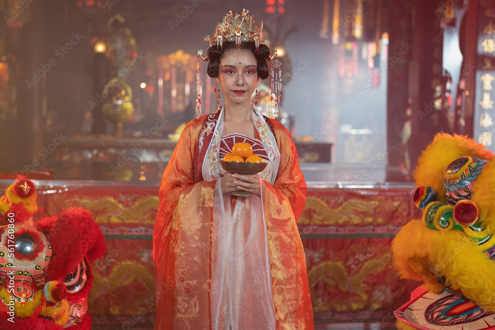 Girl in Chinese traditional dress in temple translation language is ...