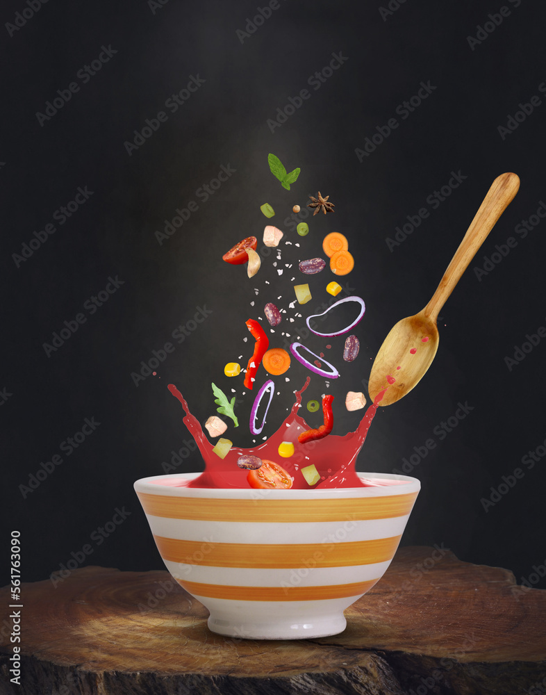 Tomato soup with beans and vegetables falling into a bowl-Photo Food ...