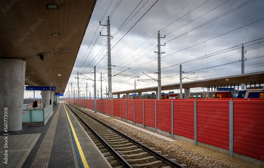 platform with red separating security wall for delimination the tracks ...