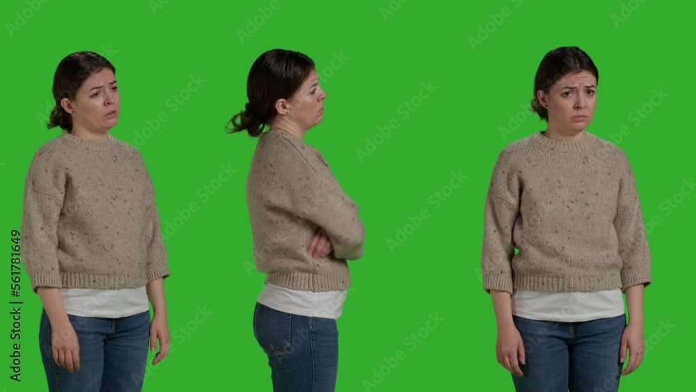 Discontent mad girl acting upset and displeased, posing over green ...