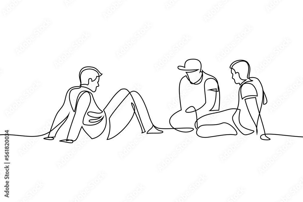 Men communicate in casual settings. Male friends sitting on the ground ...