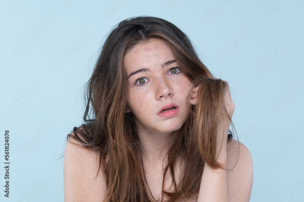 Beautiful girl feel sad, worry about her damaged hair with isolated ...