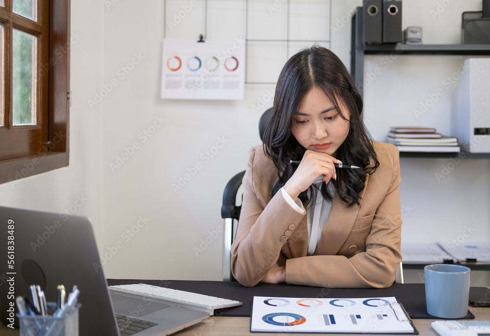 Female in a suits doing paperwork.Young business woman hold paper ...