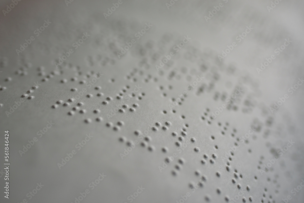 tactile braille type on white page of book for blind people - macro ...