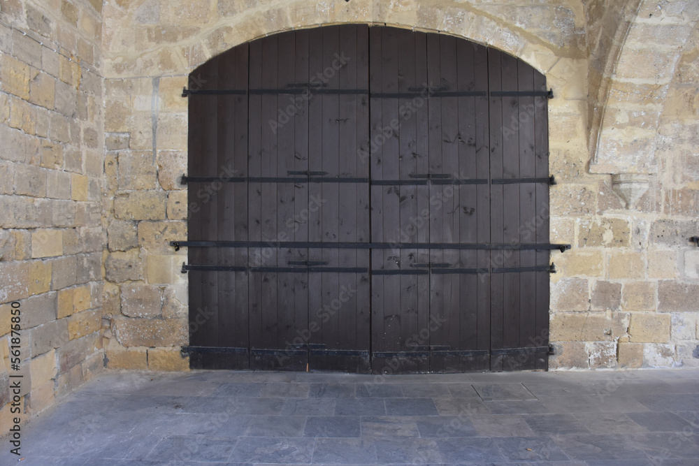 Medieval Brown Wooden Door in Stone Wall. Old castle stone wall with ...