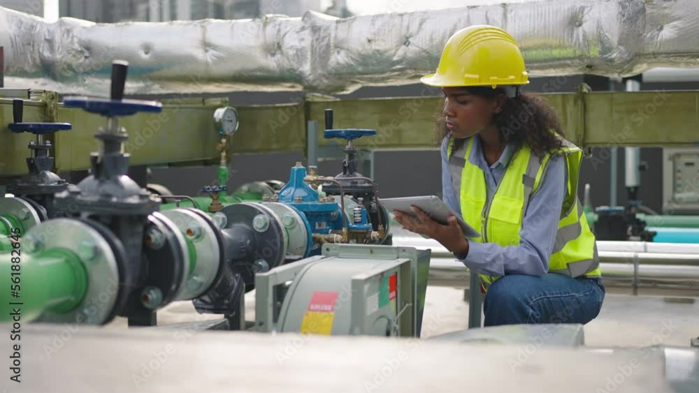 Civil engineer woman dark skin wearing uniform and safety helmet under ...