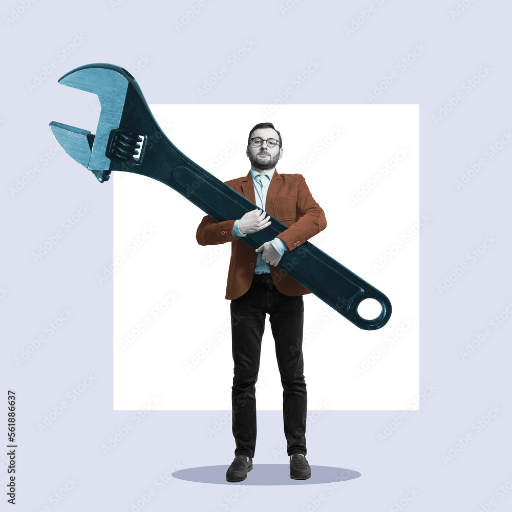 Businessman with a wrench in his hands. Technical support and repair ...