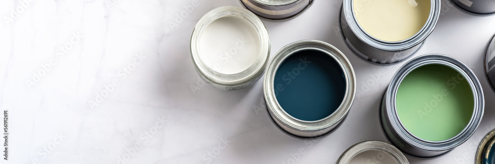 Tiny sample paint cans during house renovation, process of choosing ...
