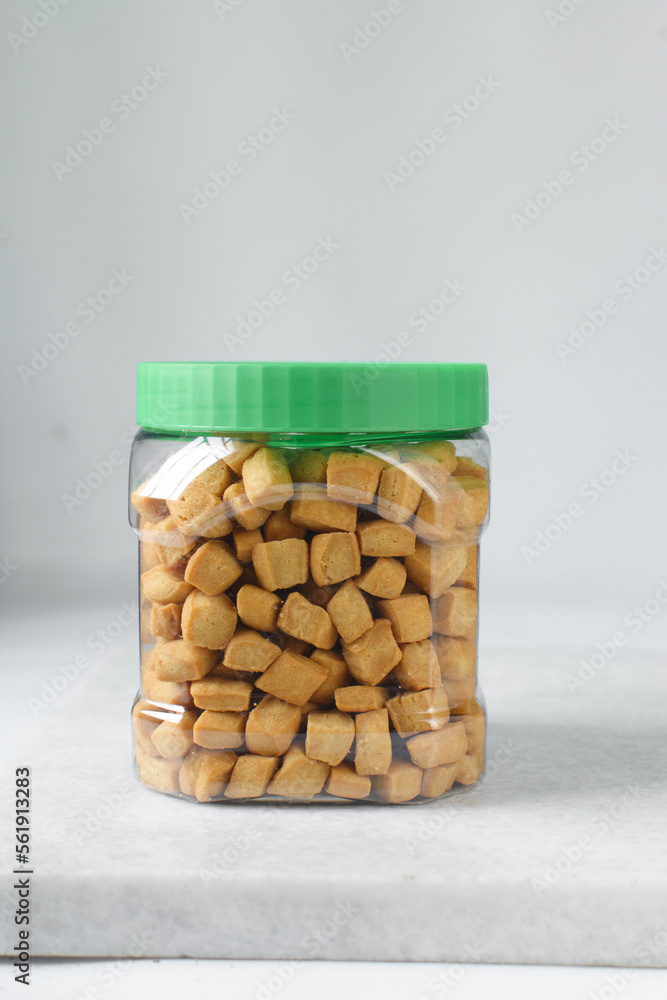 Nigerian Chin chin in a plastic jar, Fried chin-chin snack in a plastic ...