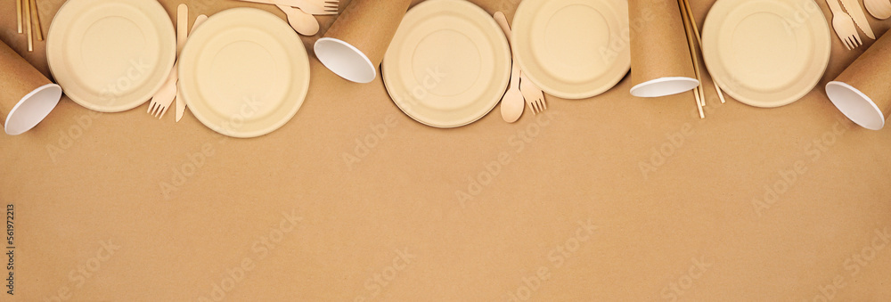 Eco friendly disposable dishware for takeout. Top border on a brown ...