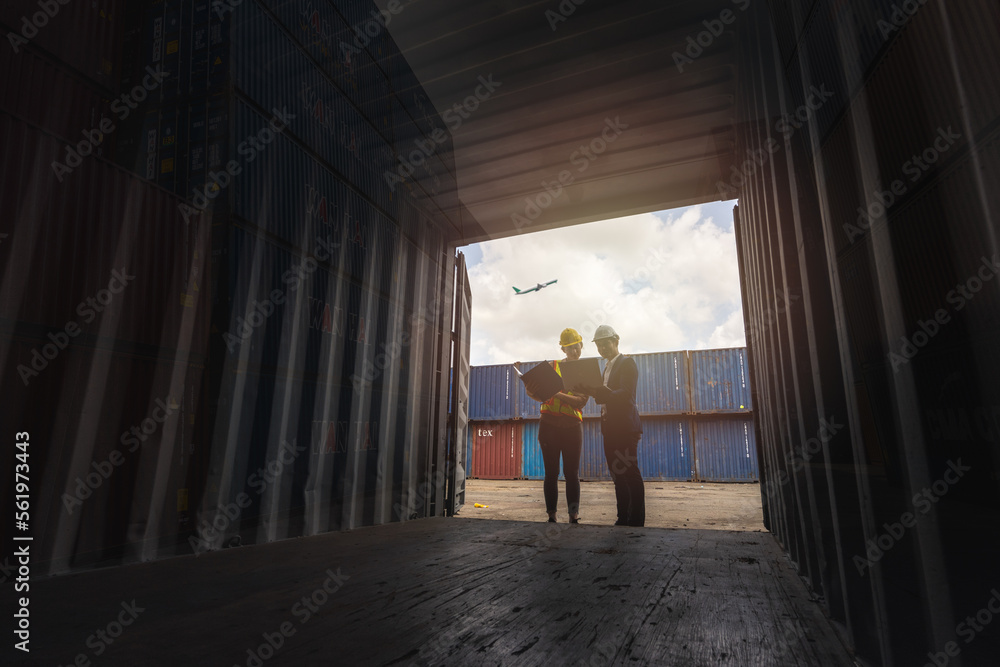 silhouette workers standing and checking the containers box from cargo ...