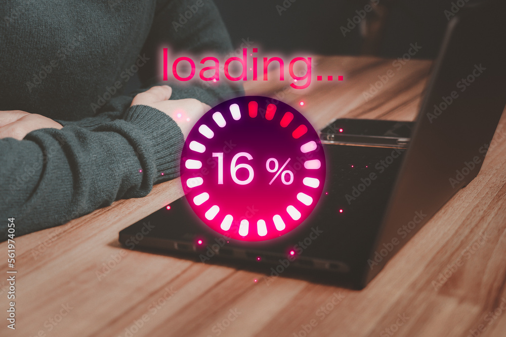 Adult man using a laptop computer for download software and waiting to ...