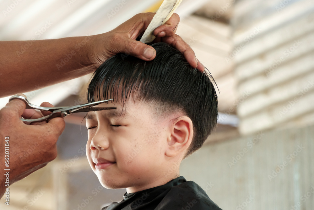 Cute Little Asian Thai Boy cutting hair. Stock Photo | Adobe Stock